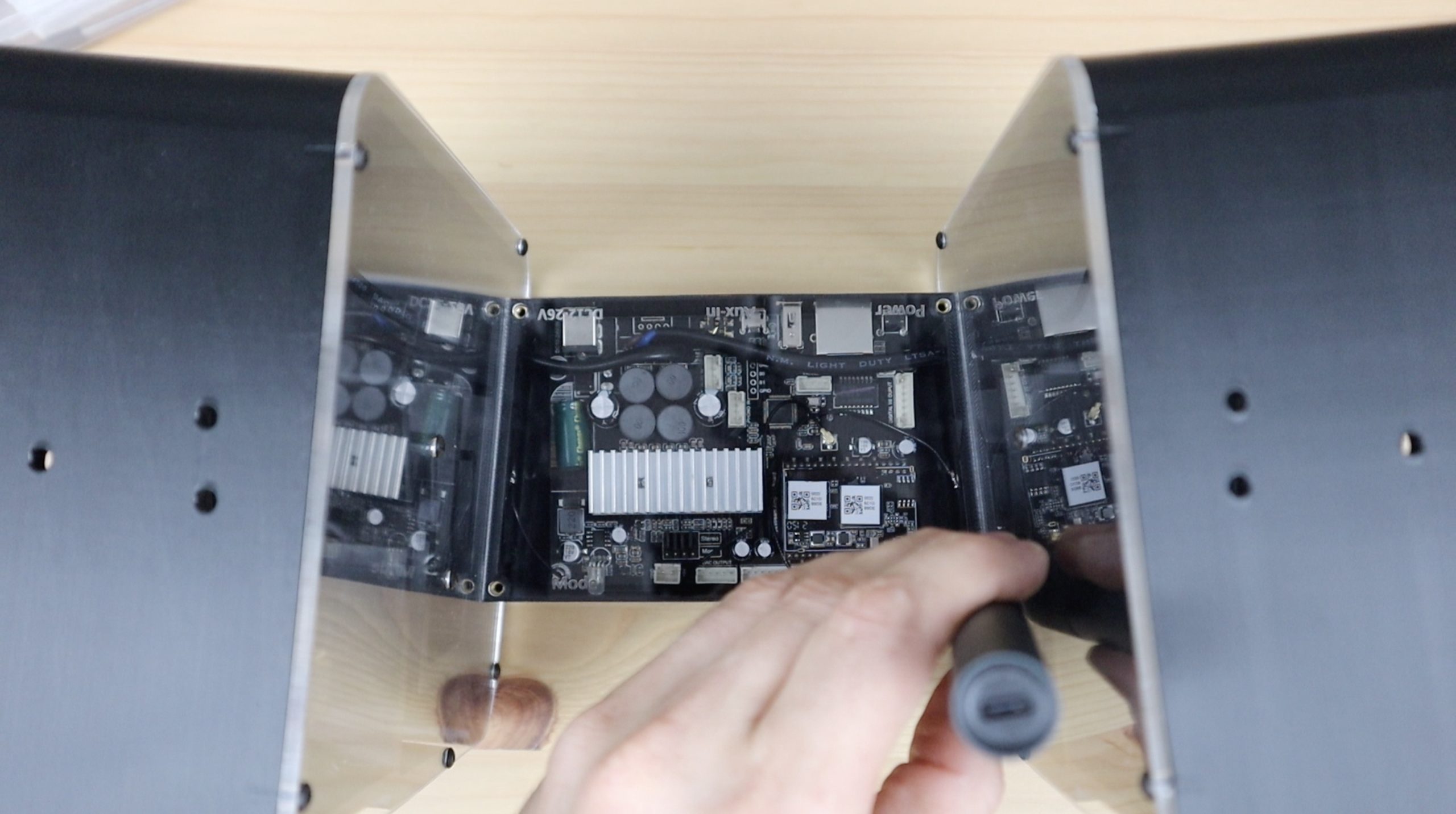 Screwing Acrylic Cover Into Place - The DIY Life